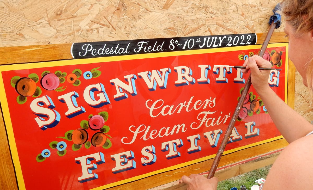 Sign Painting a Festive Farewell to the Fair